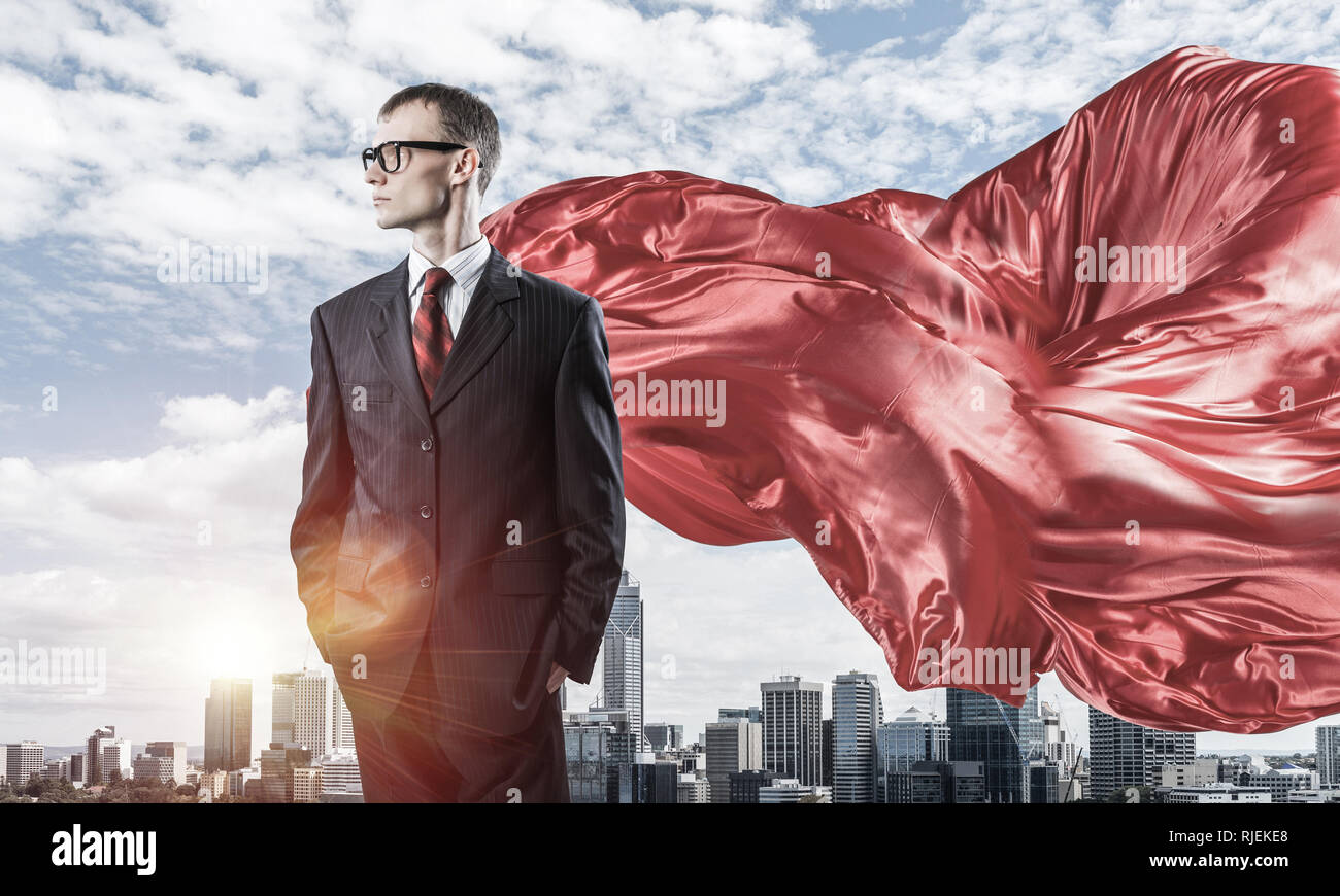 Concept of power and sucess with businessman superhero in big city ...