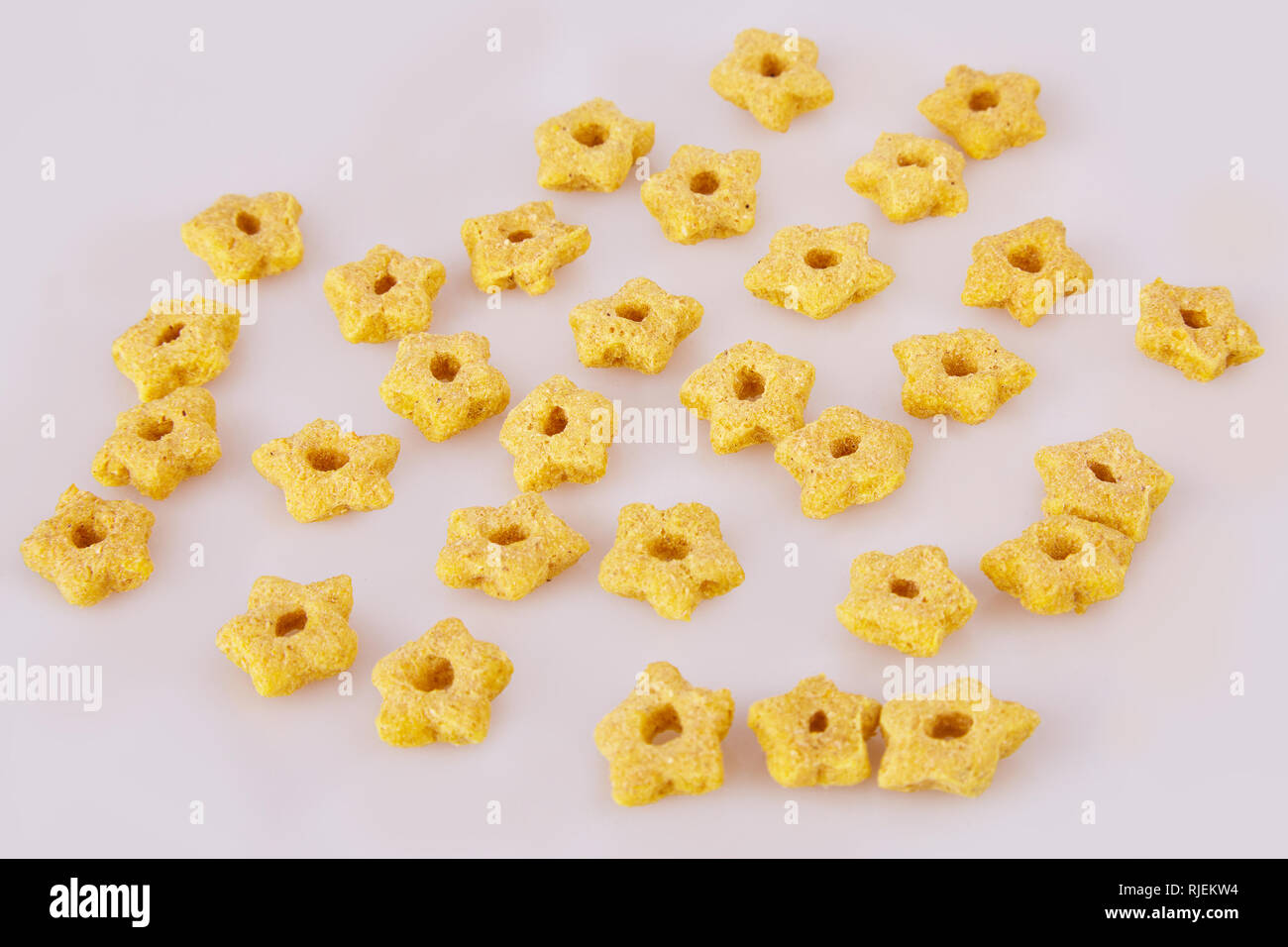 Cereal with star shape on white background Stock Photo - Alamy