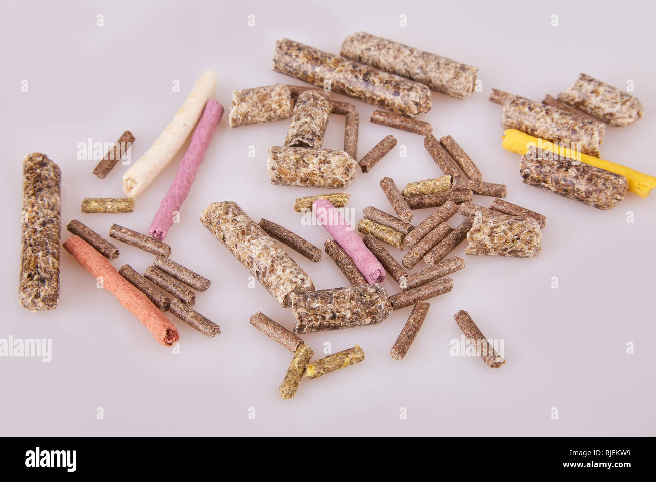 Granulated animal food on white background closeup. Different kinds of ...