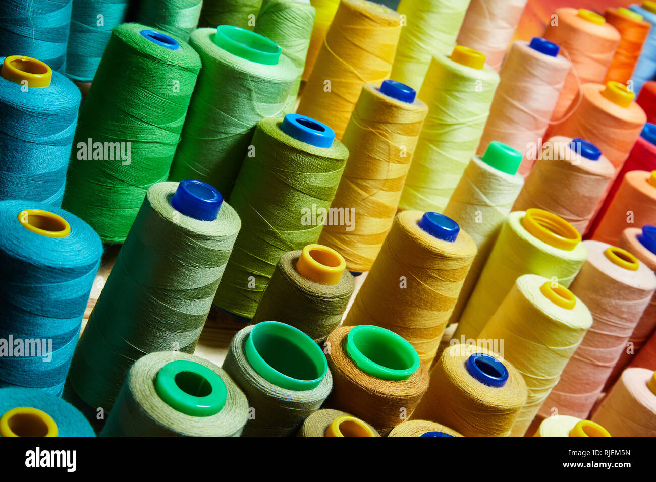 Pile of big colorful spools of thread. Concept fashion DIY clothing ...