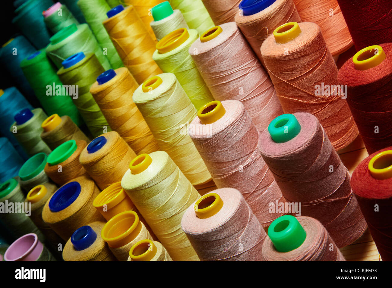 Pile of big colorful spools of thread. Concept fashion DIY clothing ...