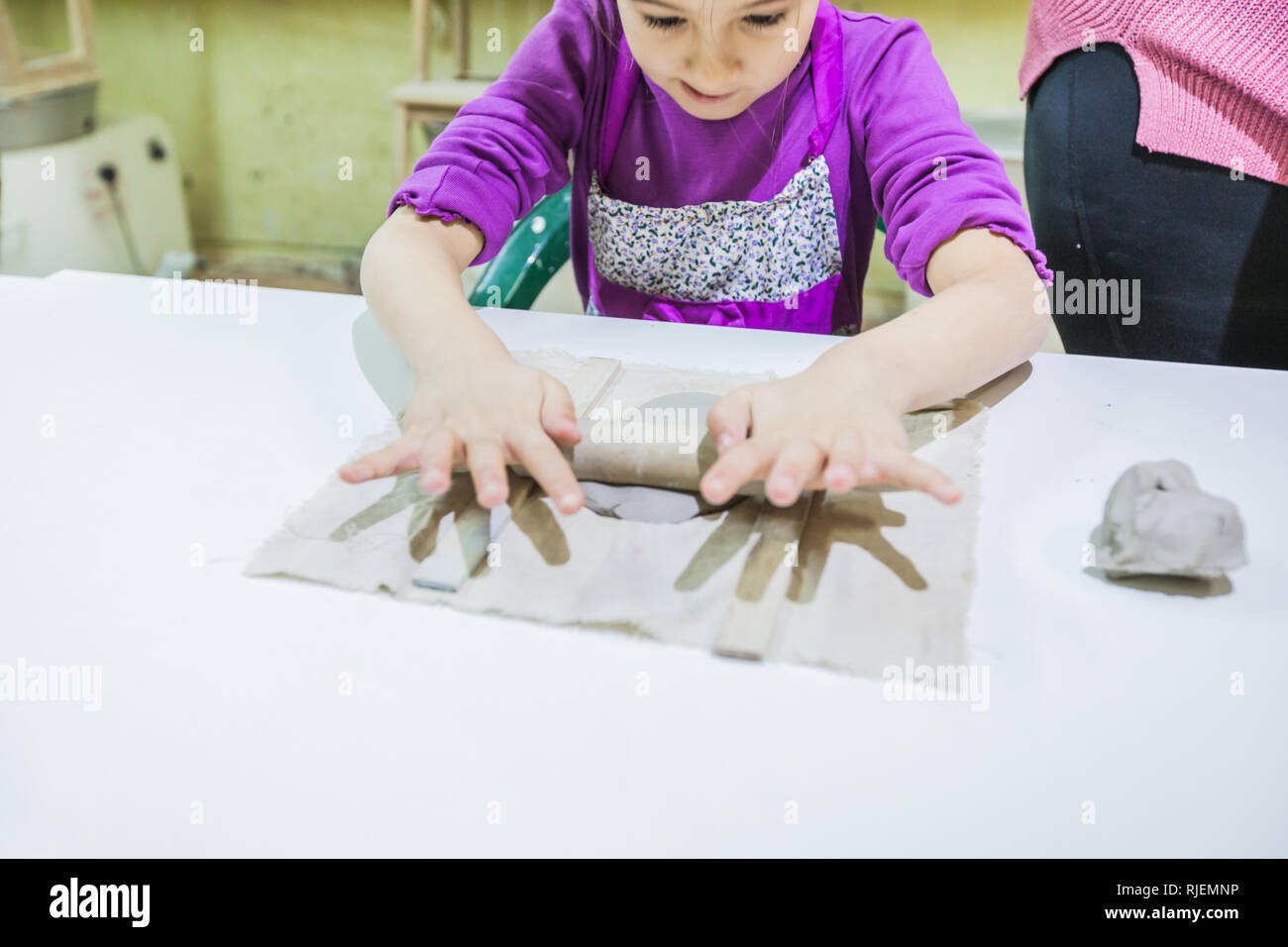 Creative children working with clay at pottery workshop Stock Photo - Alamy