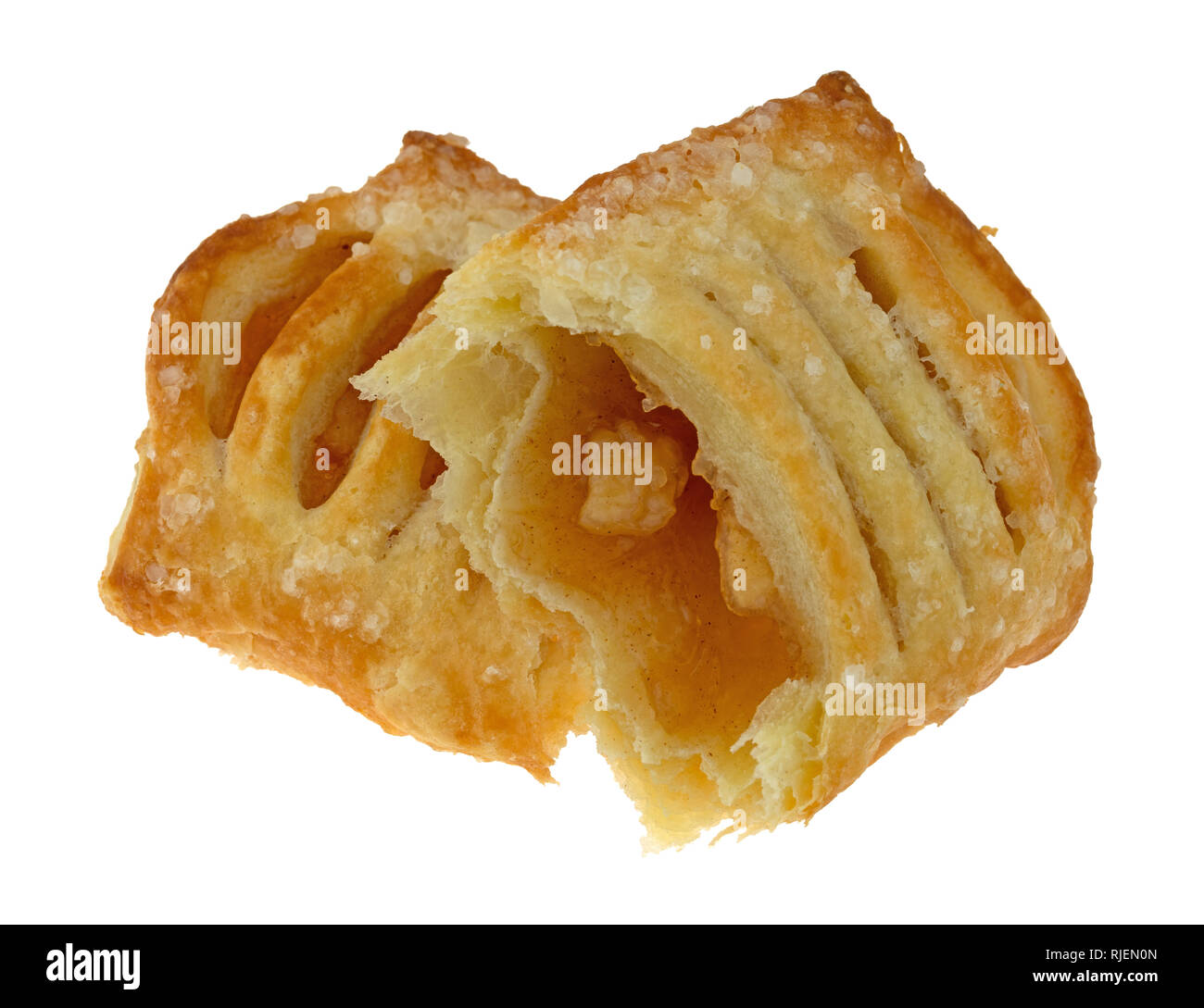 Side view of a broken pastry with apple filling isolated on a white ...