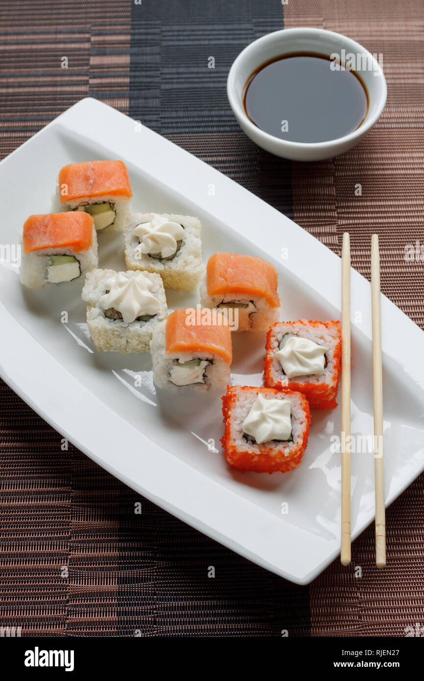 Traditional japanese seafood, roll and chopstick. Soy souce. Healthy ...