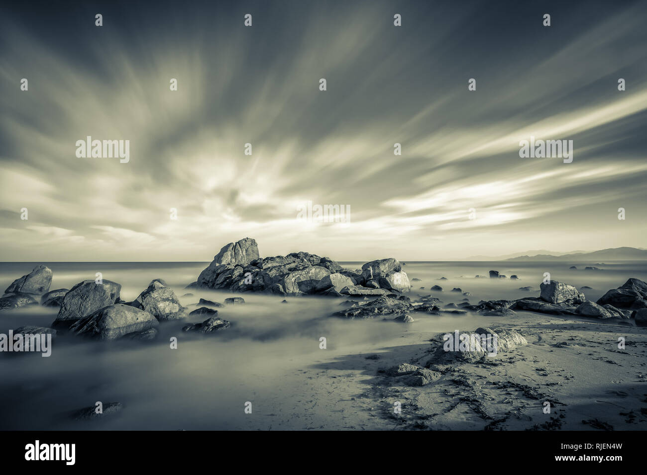 Sea water washing over black rocks hi-res stock photography and images ...