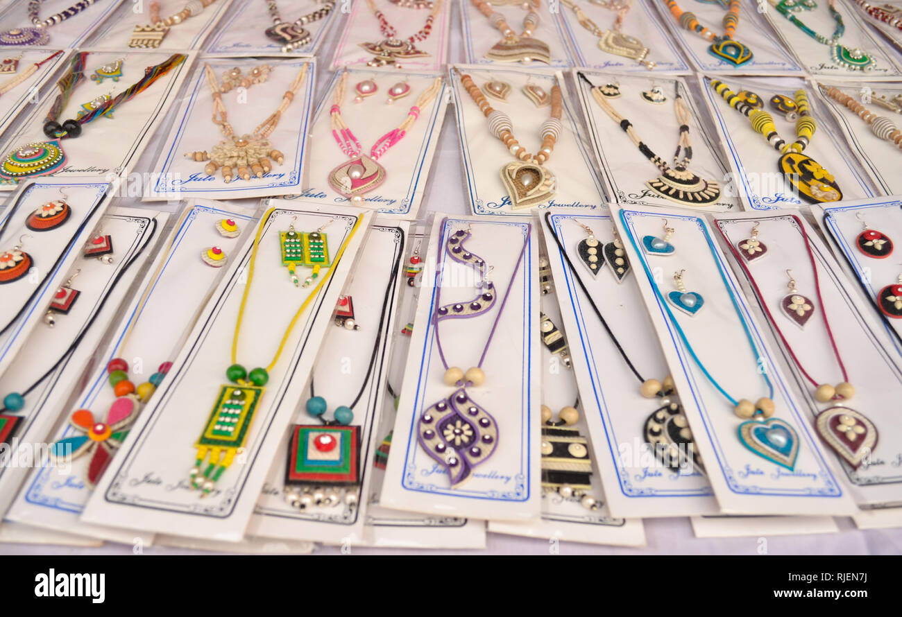 Designer jute neck pieces on display at a handicraft exhibition at shop ...