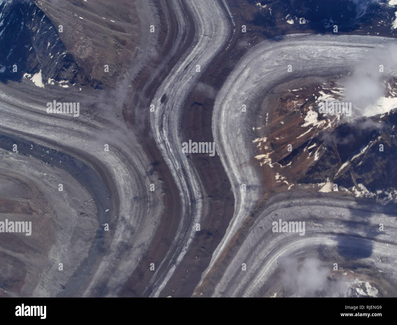Moraine bed of a high mountain glacier: streams of glacier, stones and ...