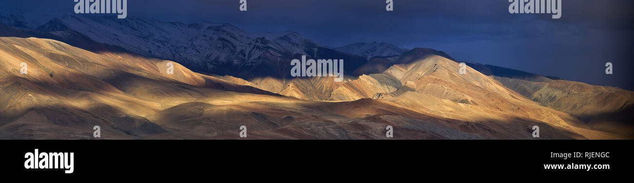 Mountain landscape, the last rays of the sun fall on a mountain valley ...