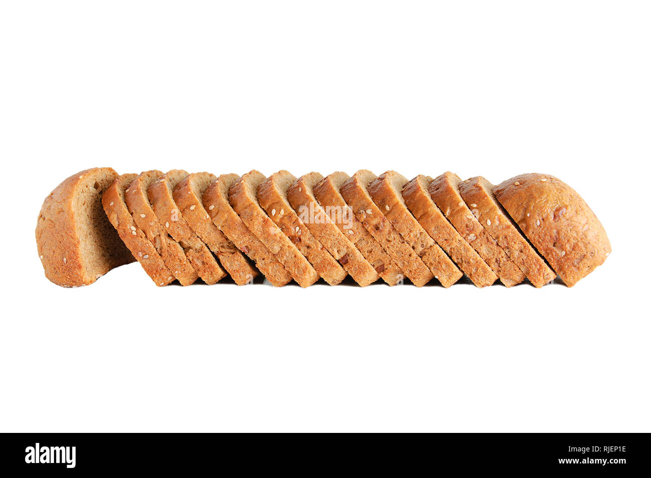 A loaf of rye bread with sunflower seeds sliced to toast. White isolate ...