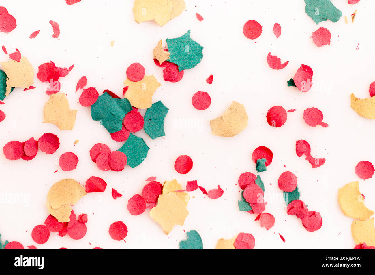 Mixed colorful confetti scattered on a white background Stock Photo - Alamy