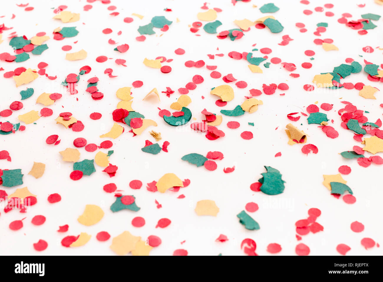 Mixed colorful confetti scattered on a white background Stock Photo - Alamy
