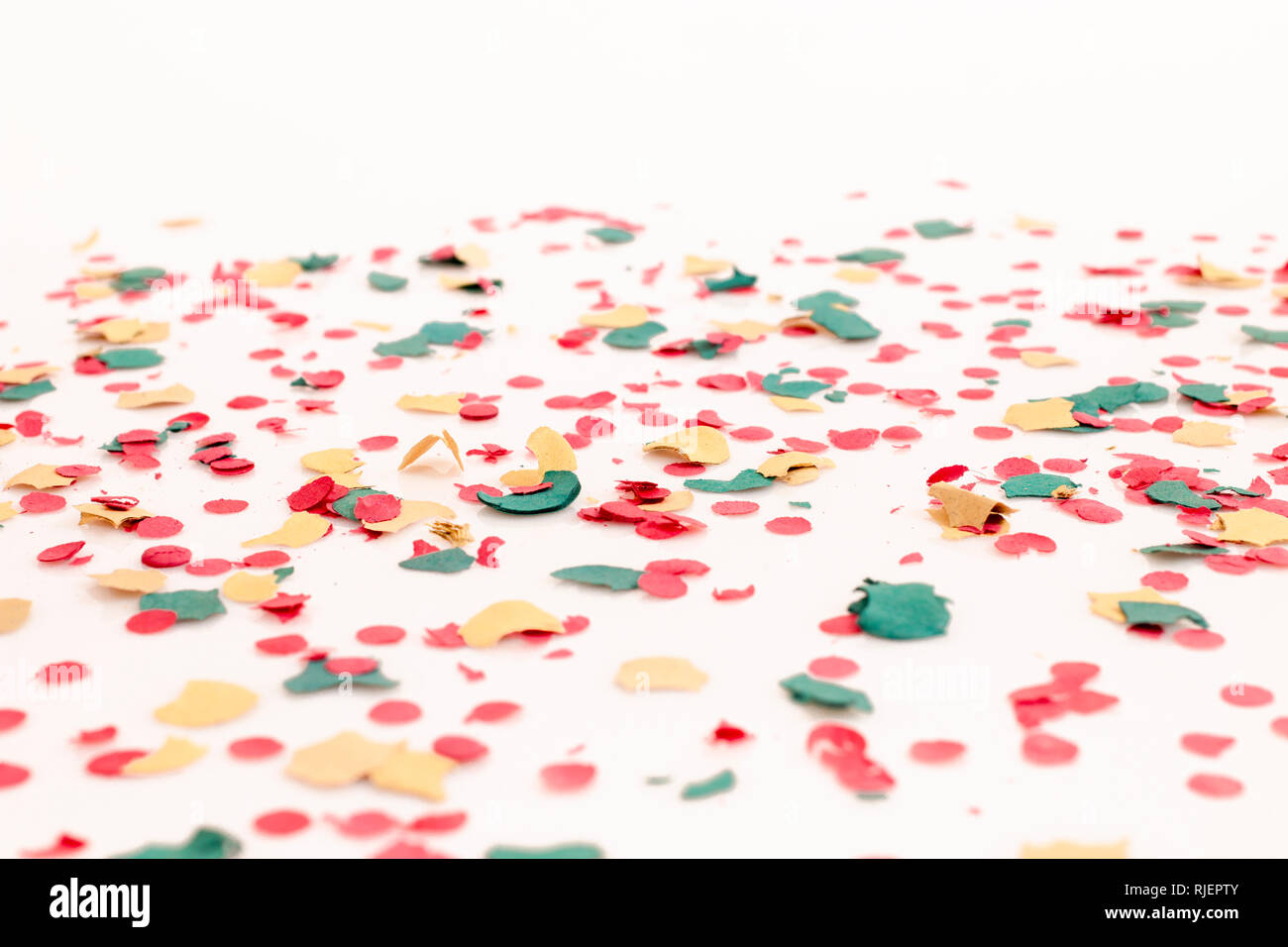 Mixed colorful confetti scattered on a white background Stock Photo - Alamy