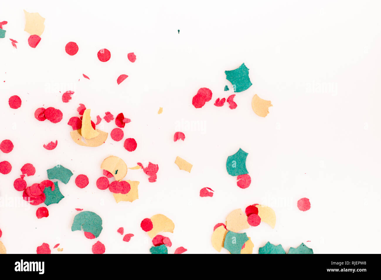 Mixed colorful confetti scattered on a white background Stock Photo - Alamy