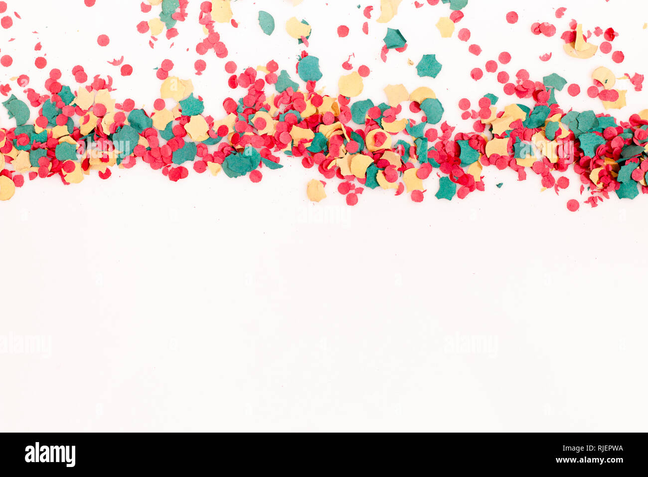 Mixed colorful confetti scattered on a white background Stock Photo - Alamy
