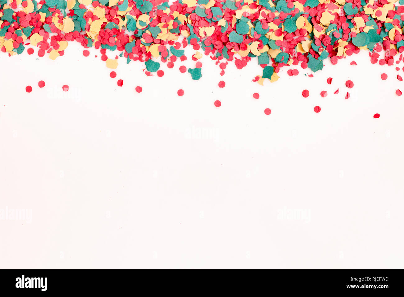 Mixed colorful confetti scattered on a white background Stock Photo - Alamy