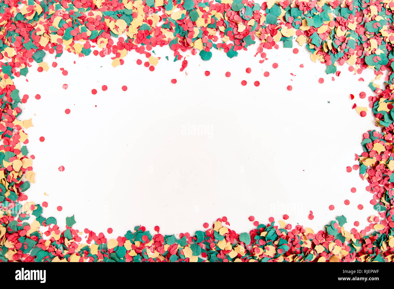 Mixed colorful confetti scattered on a white background Stock Photo - Alamy