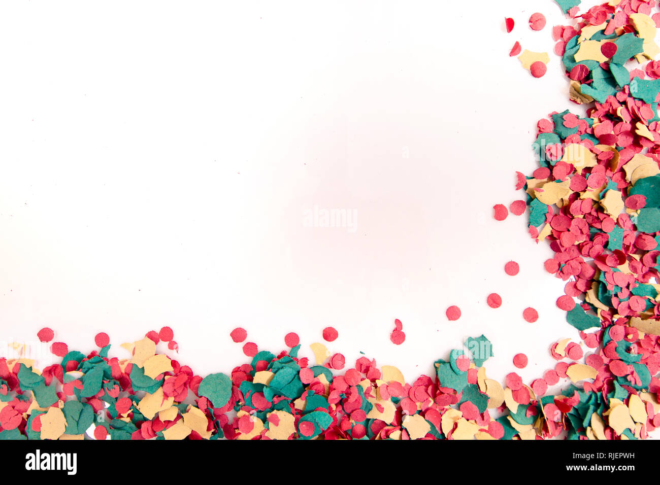 Mixed colorful confetti scattered on a white background Stock Photo - Alamy