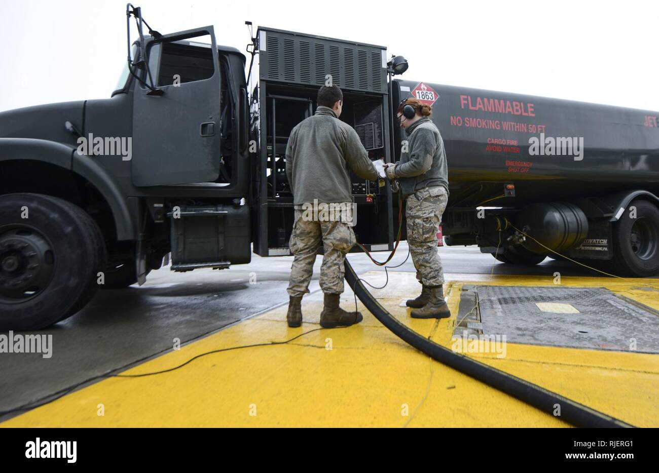 Airman 1st Class Nathan Hopkins trains Airman Britney Hogue how to ...