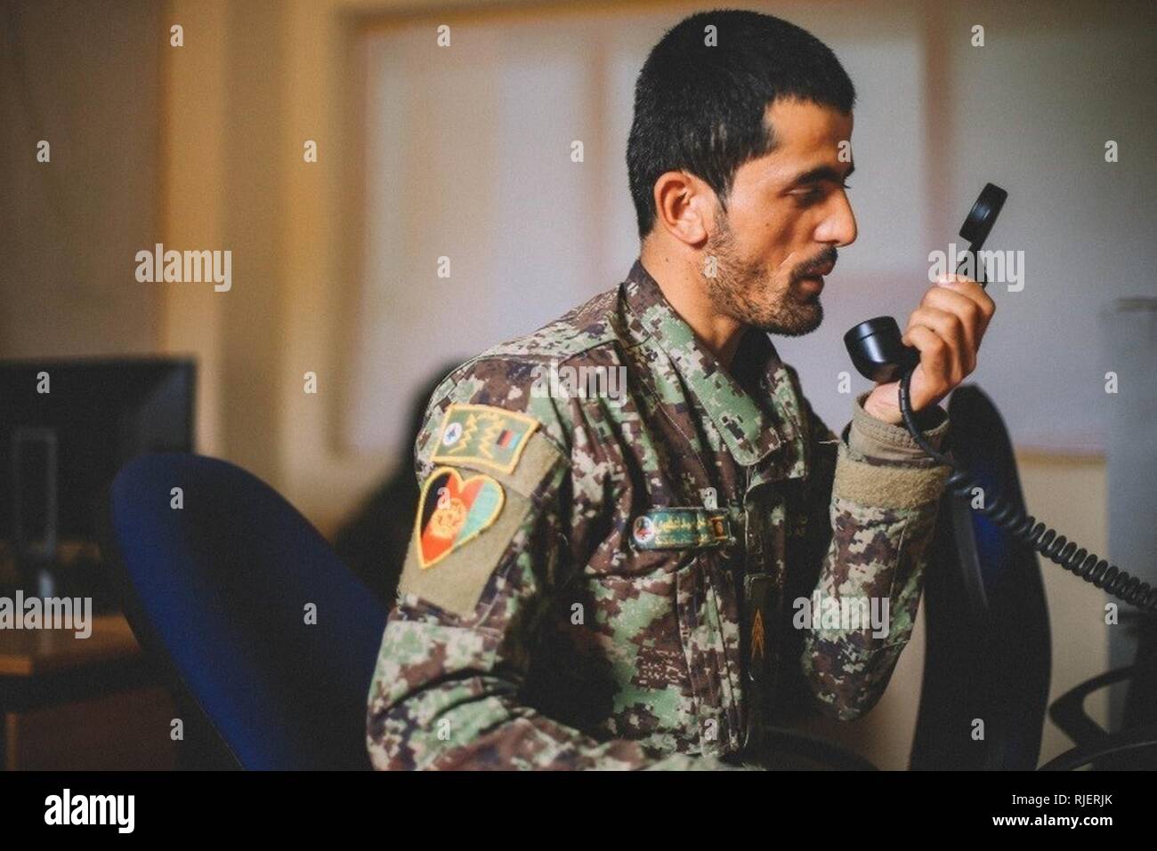 A soldier with the 215th Corps provides radio support to battle track ...