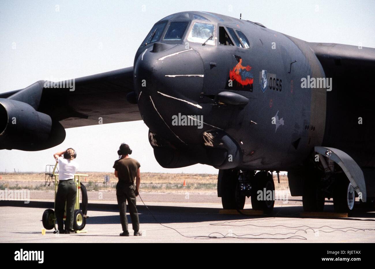 Ground crew members stand by as a 410th Bombardment Wing B-52H ...