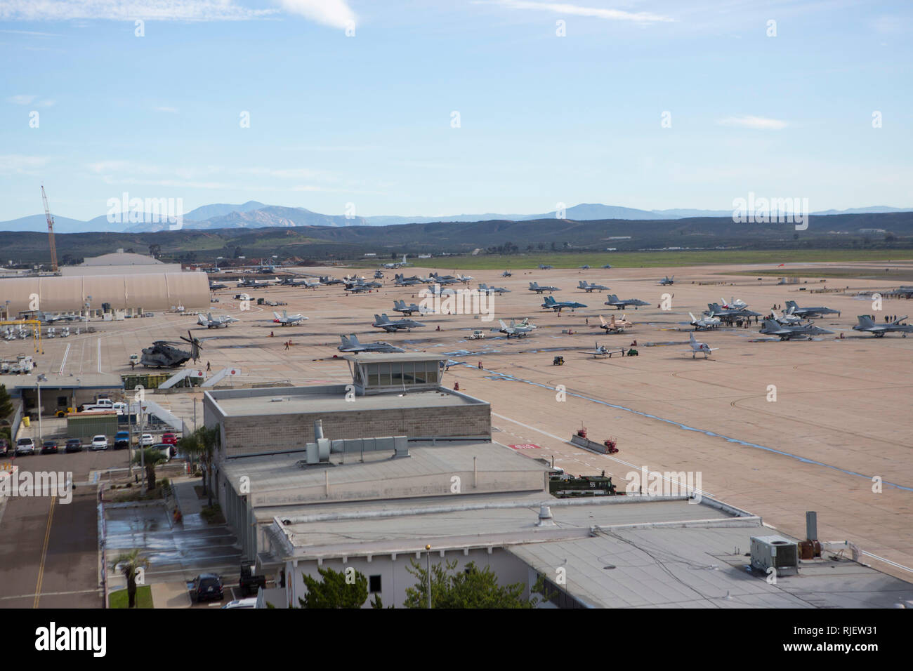 Maintainers and crew members with Marine Aircraft Group (MAG) 11 ...