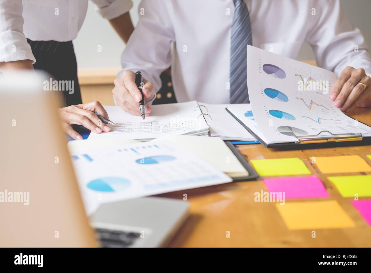 Business team data analyzing income charts document during discussion ...