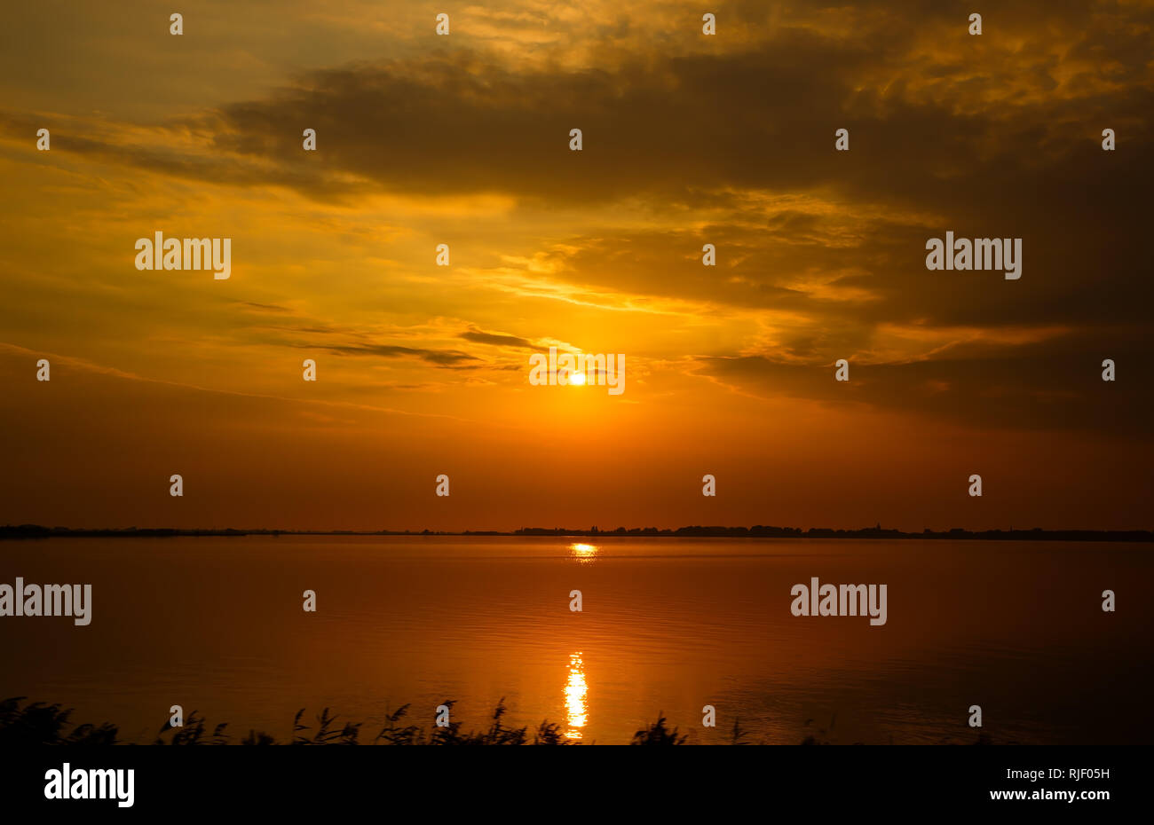 The amazing sunset above the sea Stock Photo - Alamy