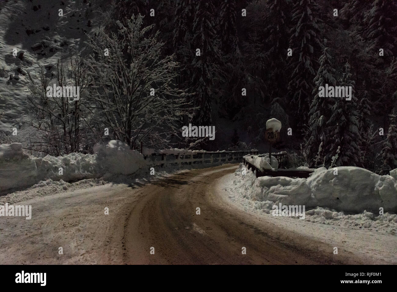 bridge in the alps covered with snow at night Stock Photo - Alamy