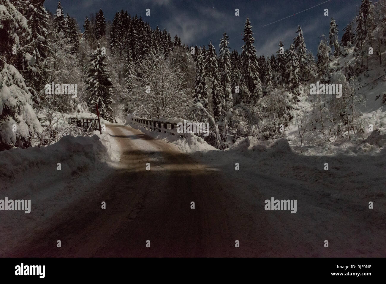bridge in the alps covered with snow at night Stock Photo - Alamy