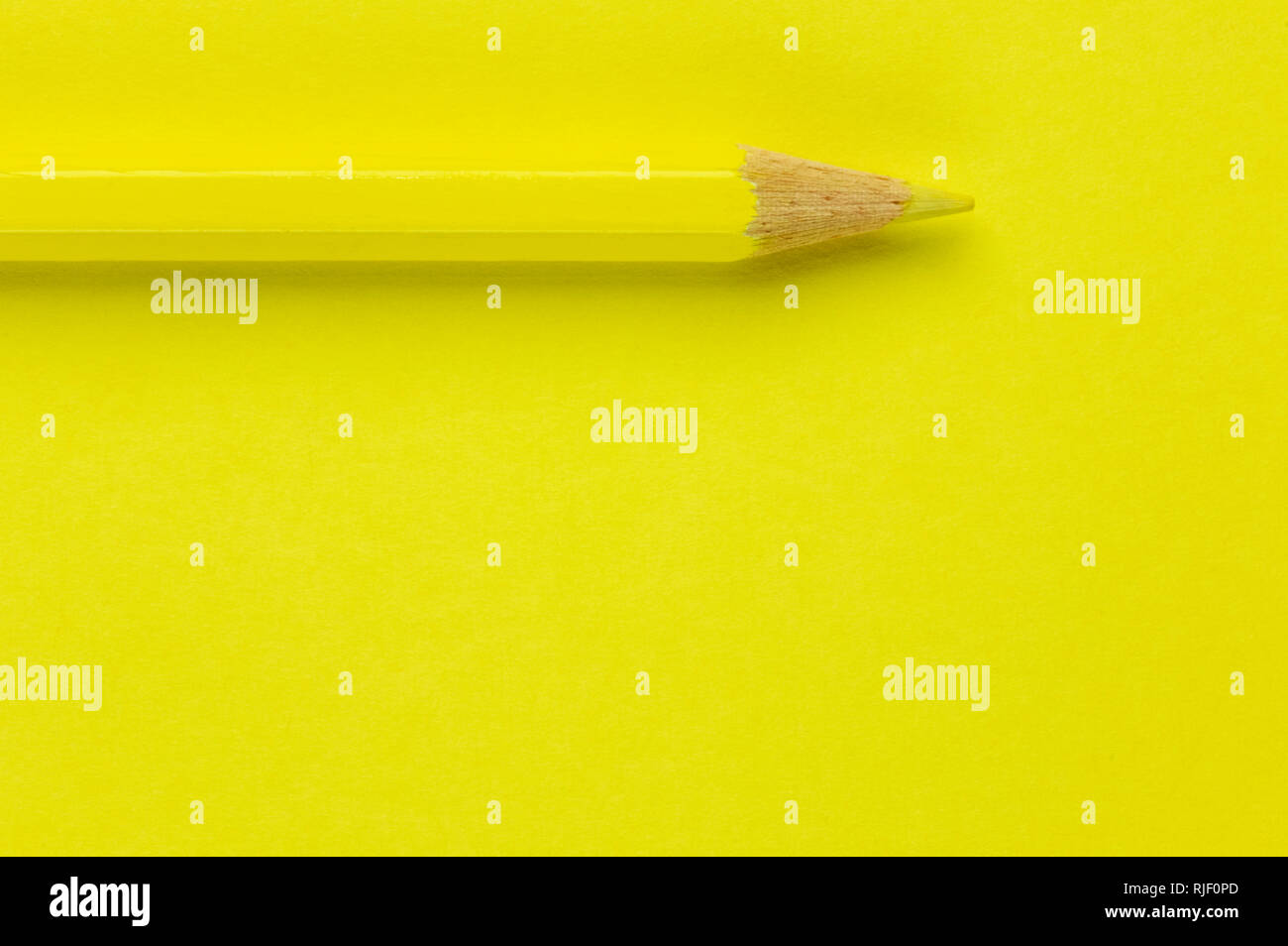 One yellow pencil on a yellow background ,beautiful monochromatic ...