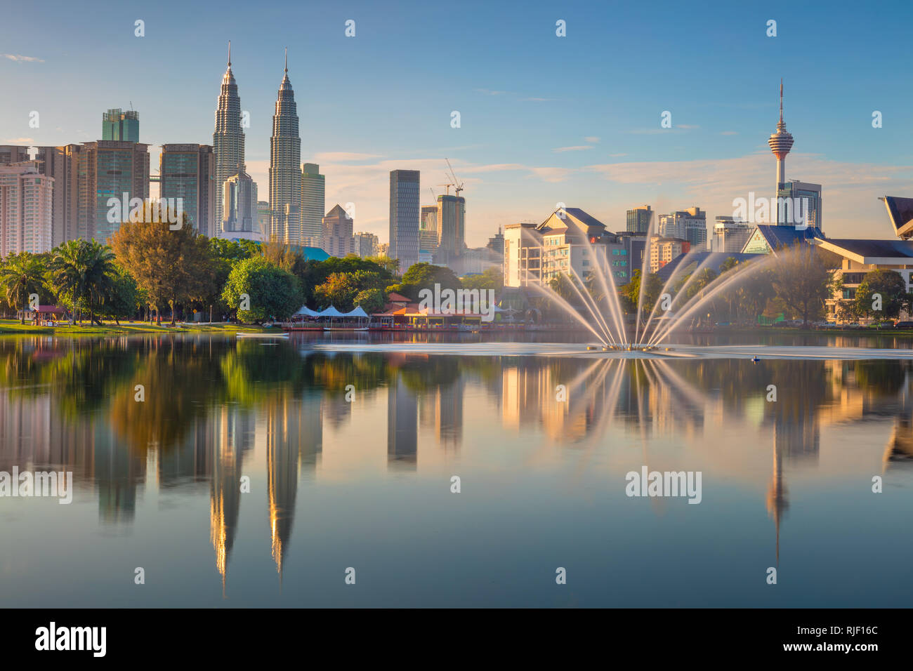 Panoramic view of Kuala Lumpur city waterfront skyline with reflections ...