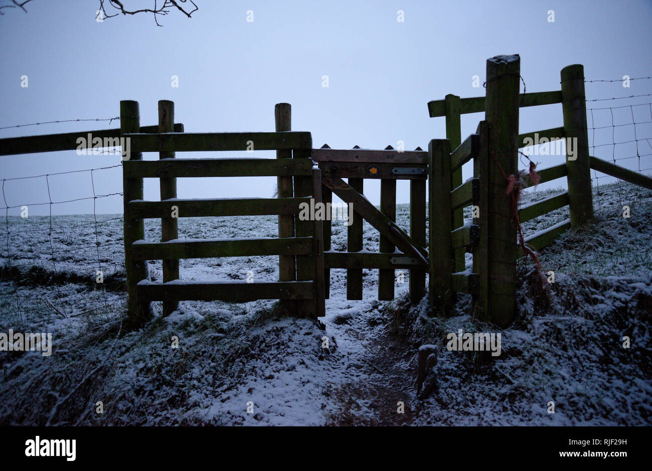 Snowy dawn in the Peak District National Park, England. Twilight light ...