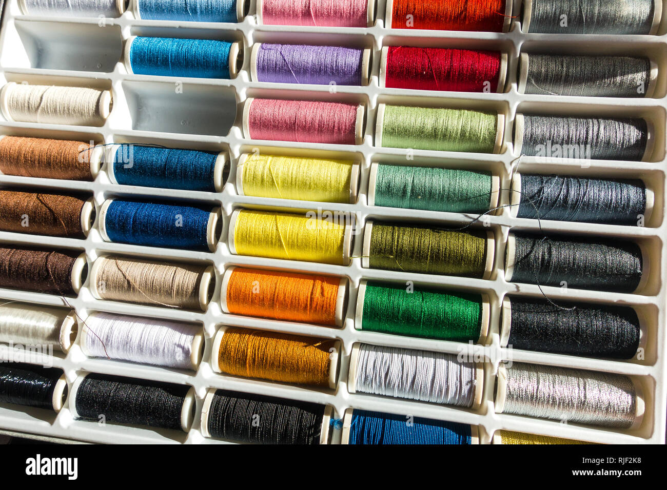 sewing spools of coloured threads UK Stock Photo - Alamy