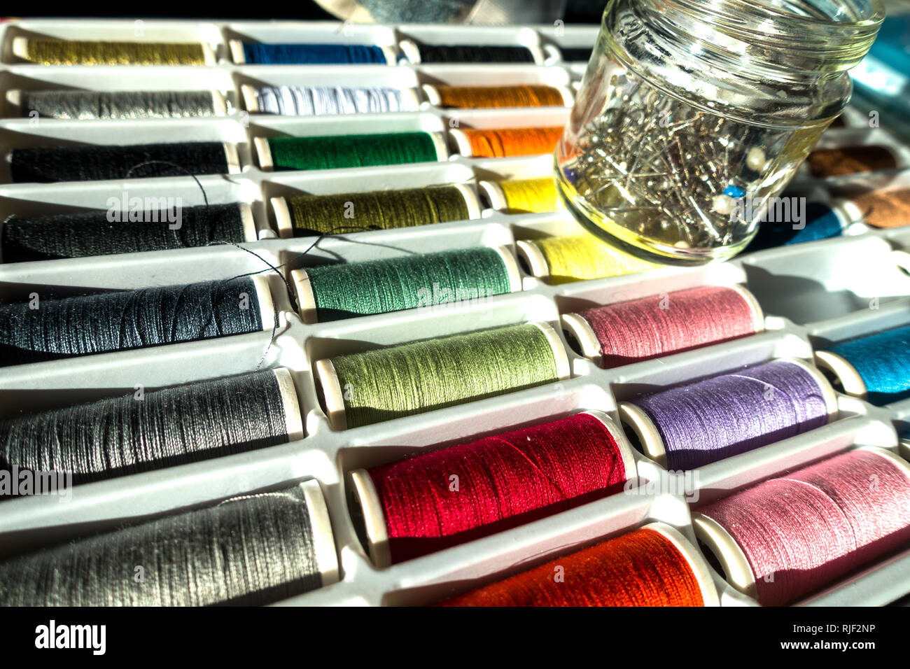 sewing spools of coloured threads UK Stock Photo - Alamy