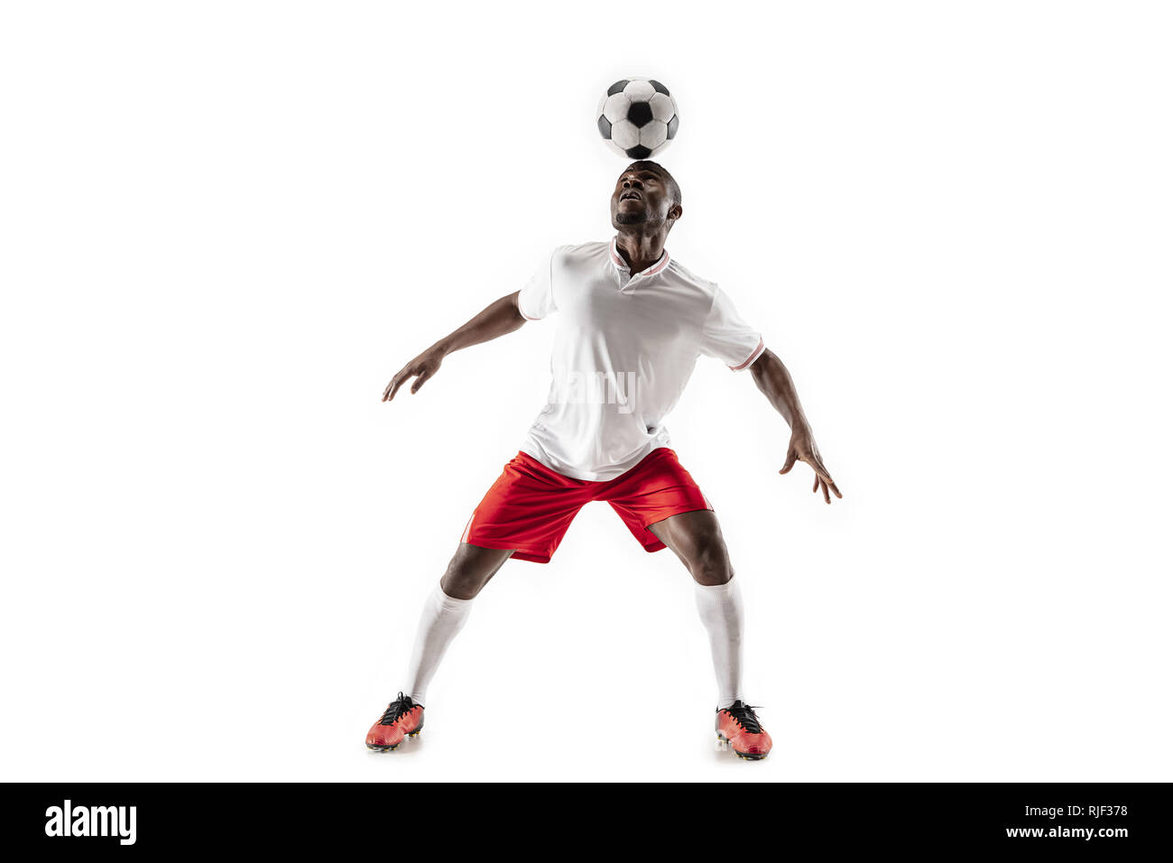 Professional african american football soccer player in motion isolated ...