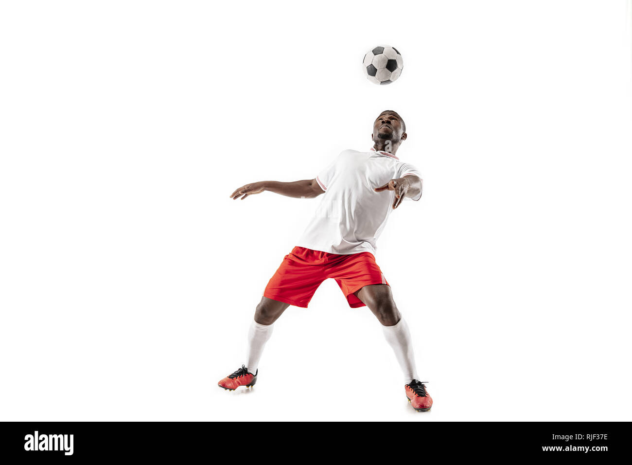 Professional african american football soccer player in motion isolated ...