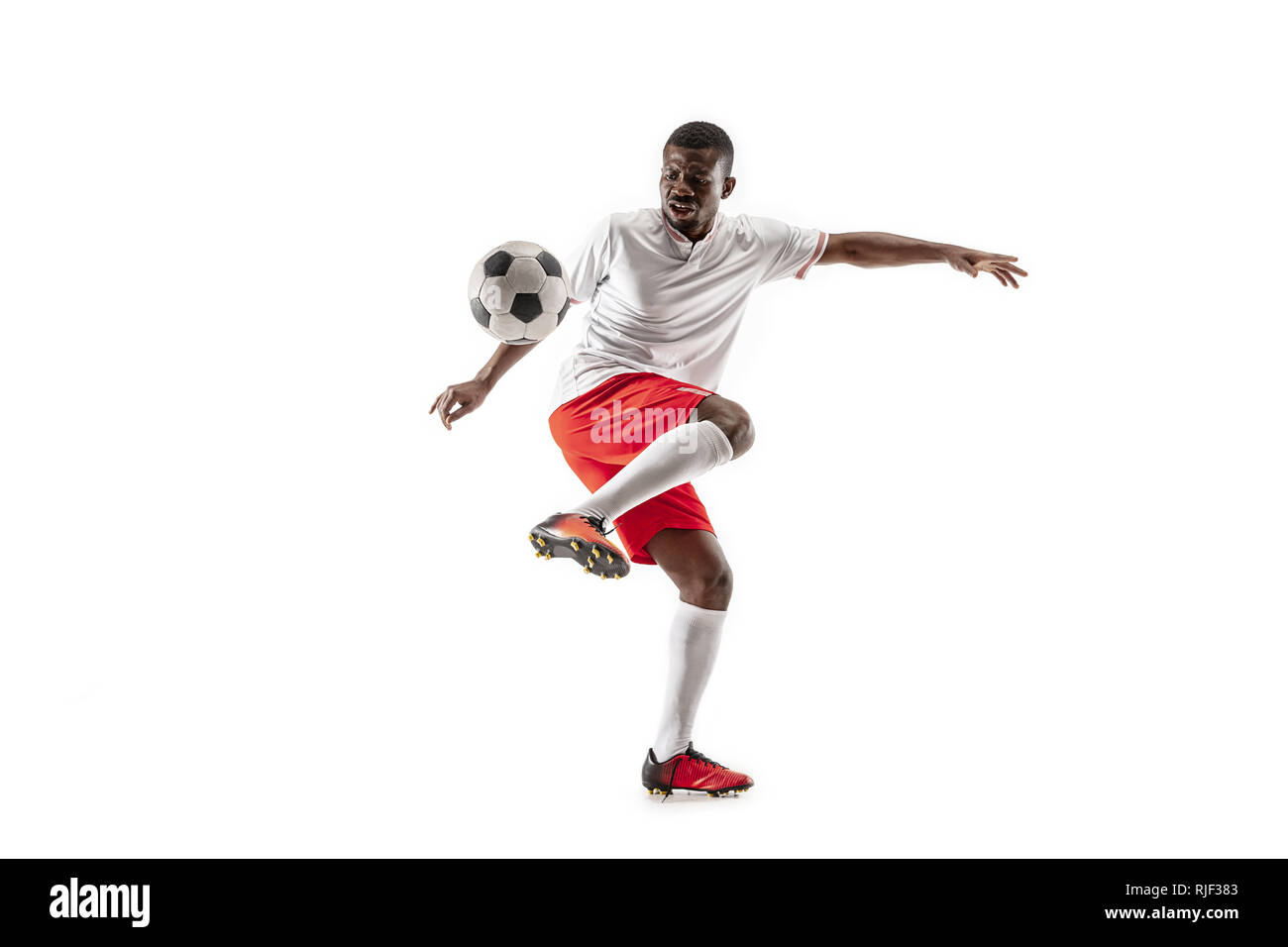 Professional african american football soccer player in motion isolated ...