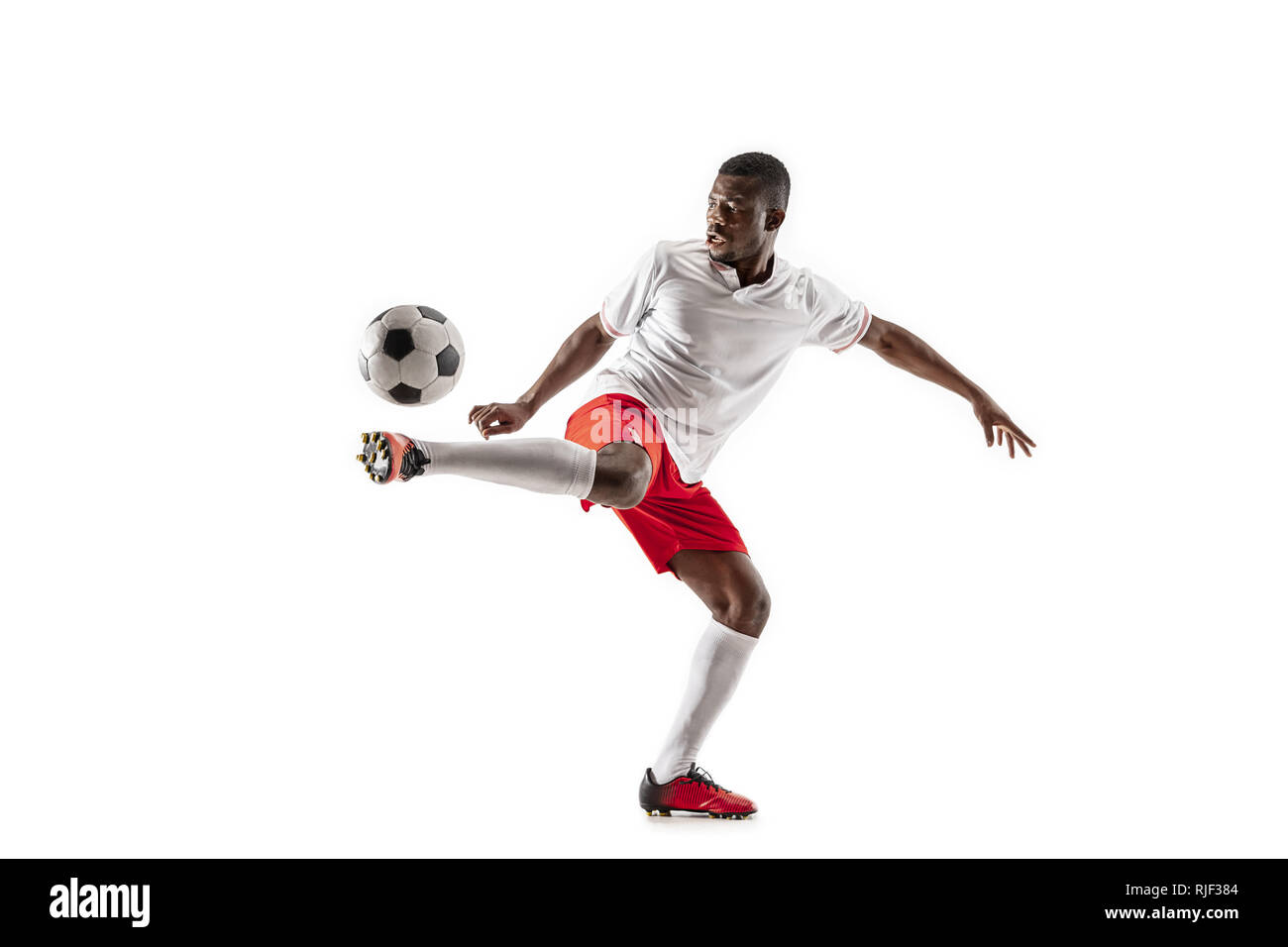 Professional african american football soccer player in motion isolated ...