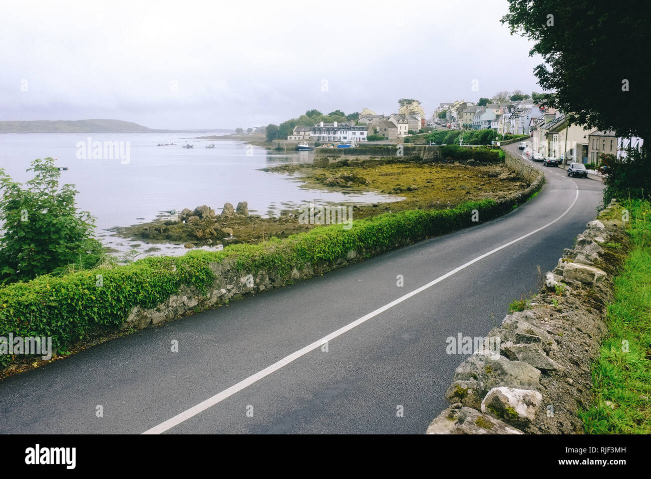 a coastal road with sea views ends in a small village Stock Photo - Alamy
