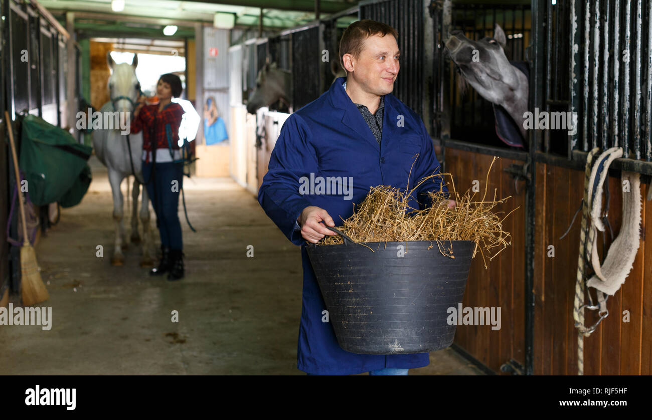 Couple working in stable hi-res stock photography and images - Alamy