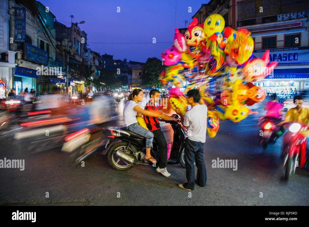 Hanoi, Vietnam; Man selling balloons in Hang Dao Stock Photo - Alamy