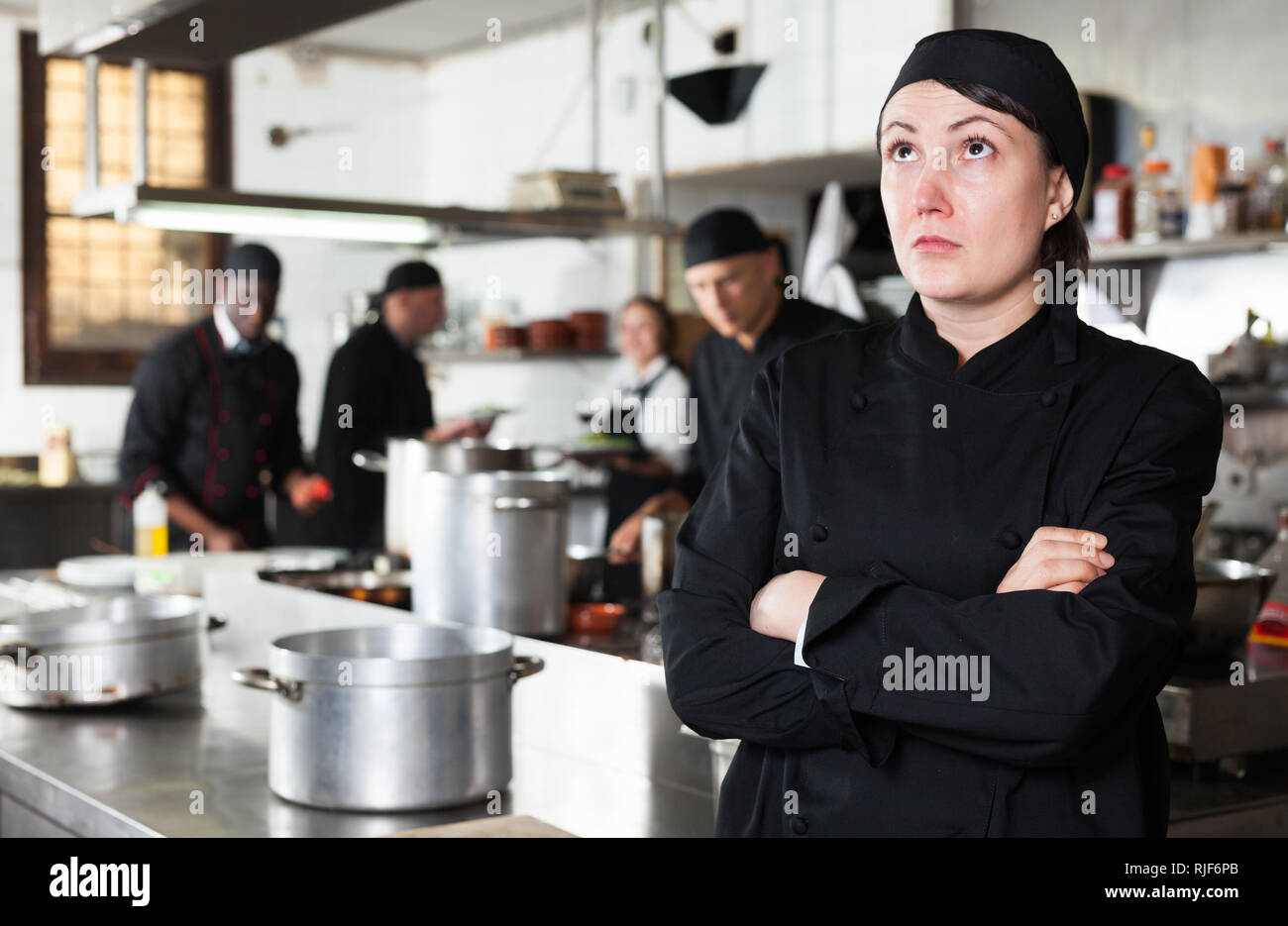 Upset female cook in kitchen of restaurant Stock Photo - Alamy