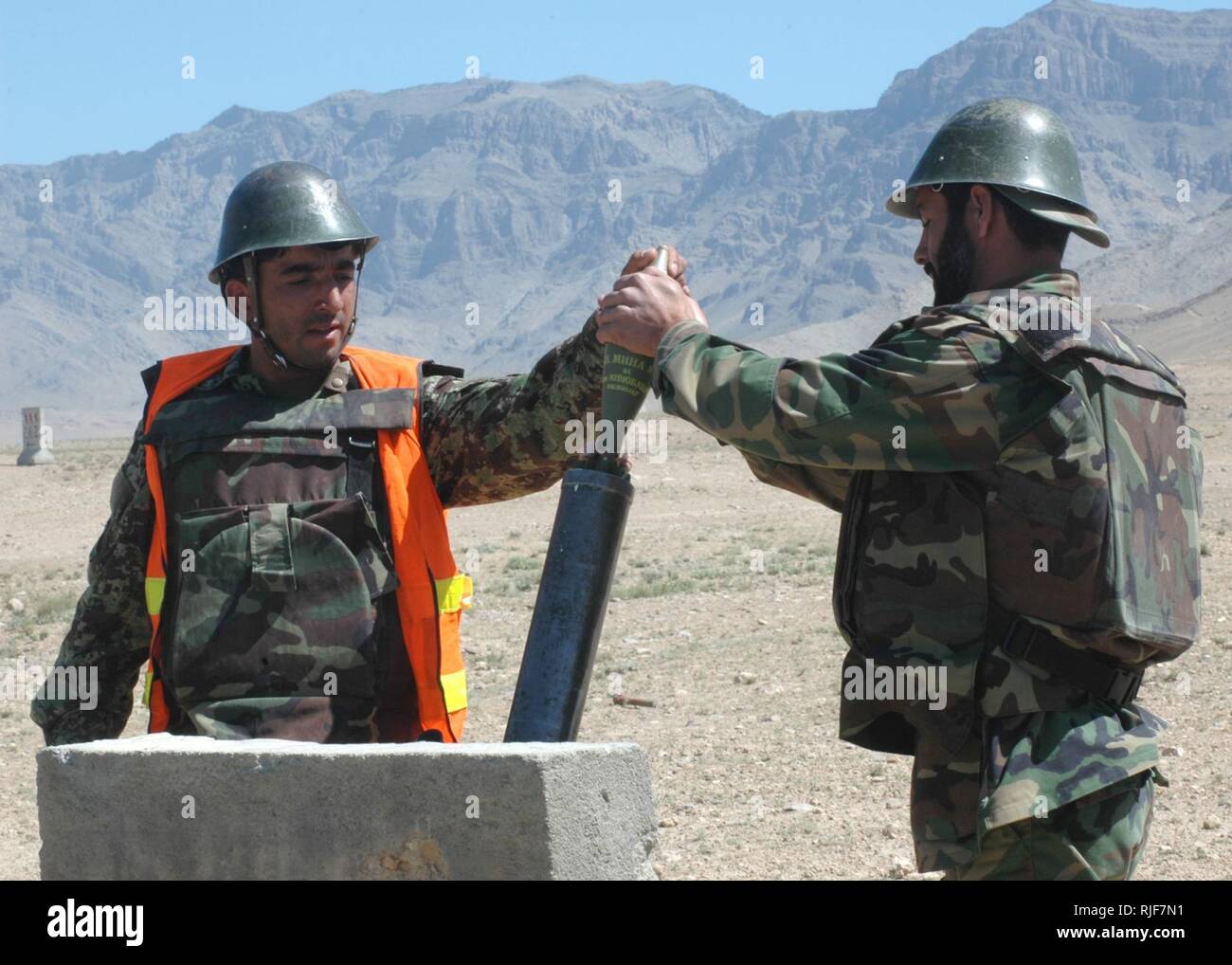 (Kabul, Afghanistan) An Afghan National Army mortar instructor assists ...