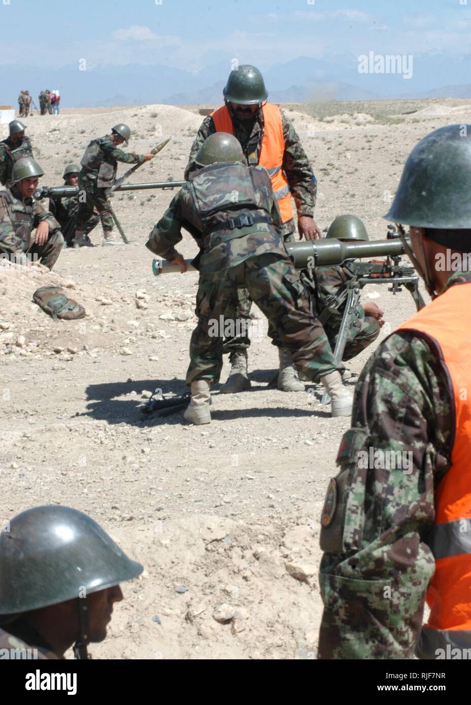(Kabul, Afghanistan) An Afghan National Army trainee inserts a round ...
