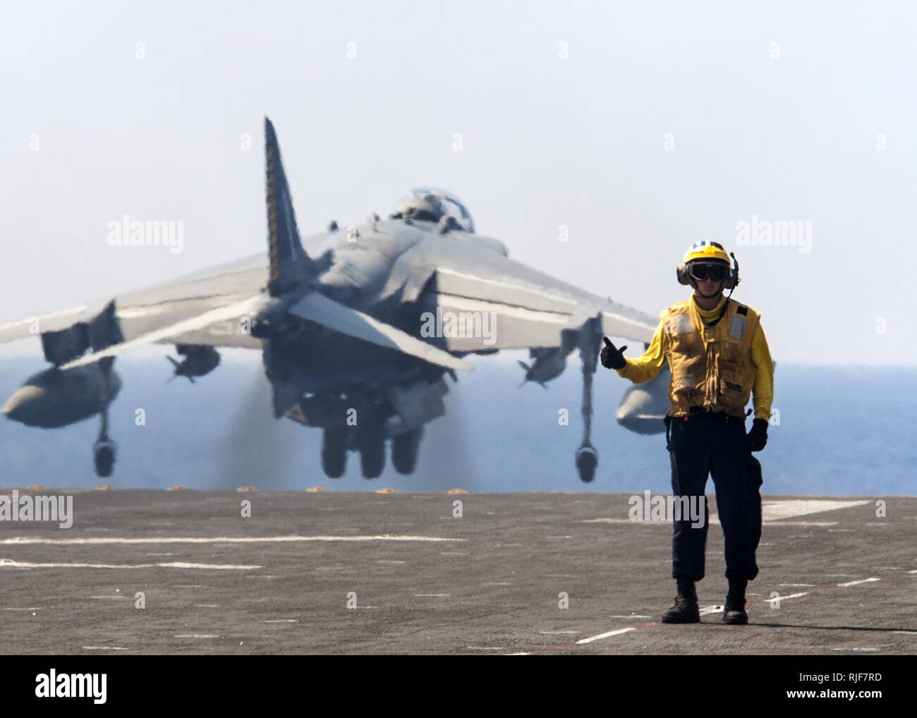An AV-8B Harrier takes off from the flight deck of USS Wasp ...