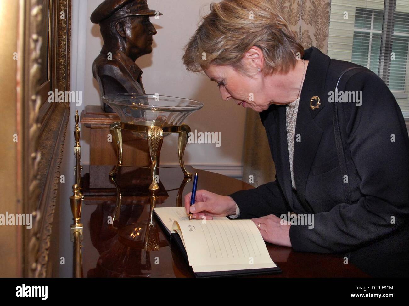 Norwegian Minister of Defense Ann-Grete Strom-Erichsen signs a guest ...