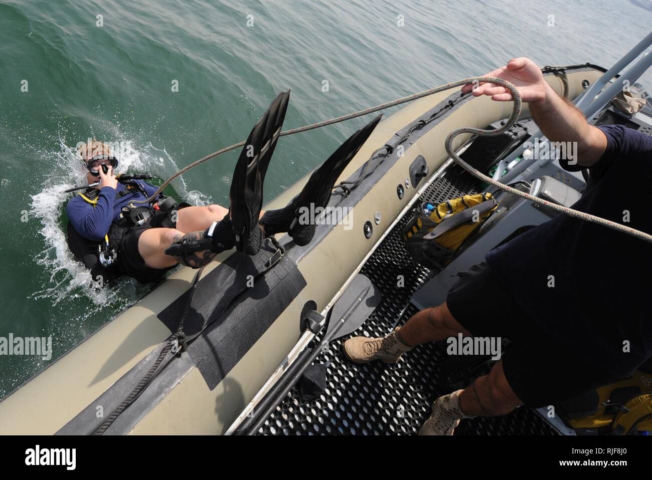 Navy Petty Officer 2nd Class Justin Cavitt, a diver assigned to Mobile ...