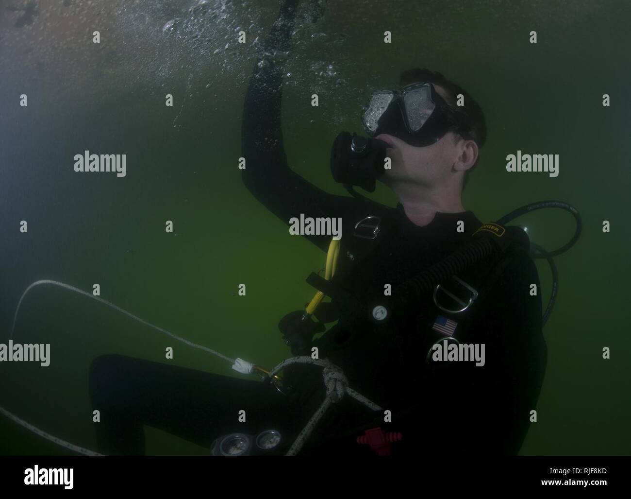 Navy Diver 3rd Class Travis Neel, assigned to Mobile Diving and Salvage ...