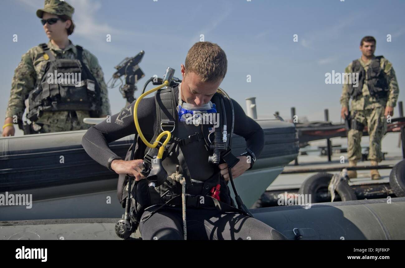 Navy Diver 3rd Class Chad Crawford, assigned to Mobile Diving and ...