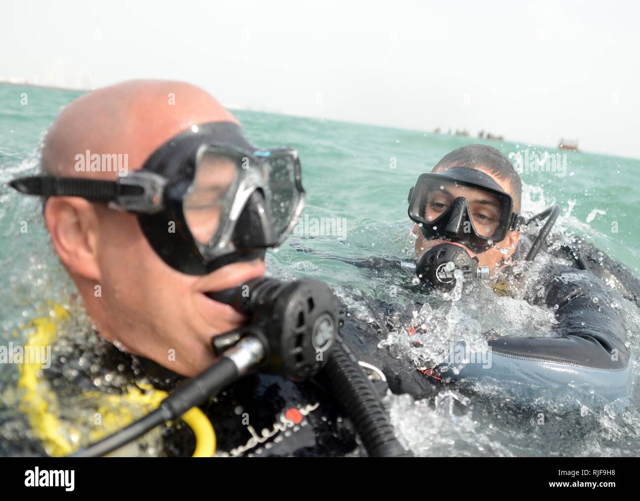 MINA SALMAN PIER, Bahrain (Feb. 13, 2013) Navy Diver 1st Class Ben Cohn ...